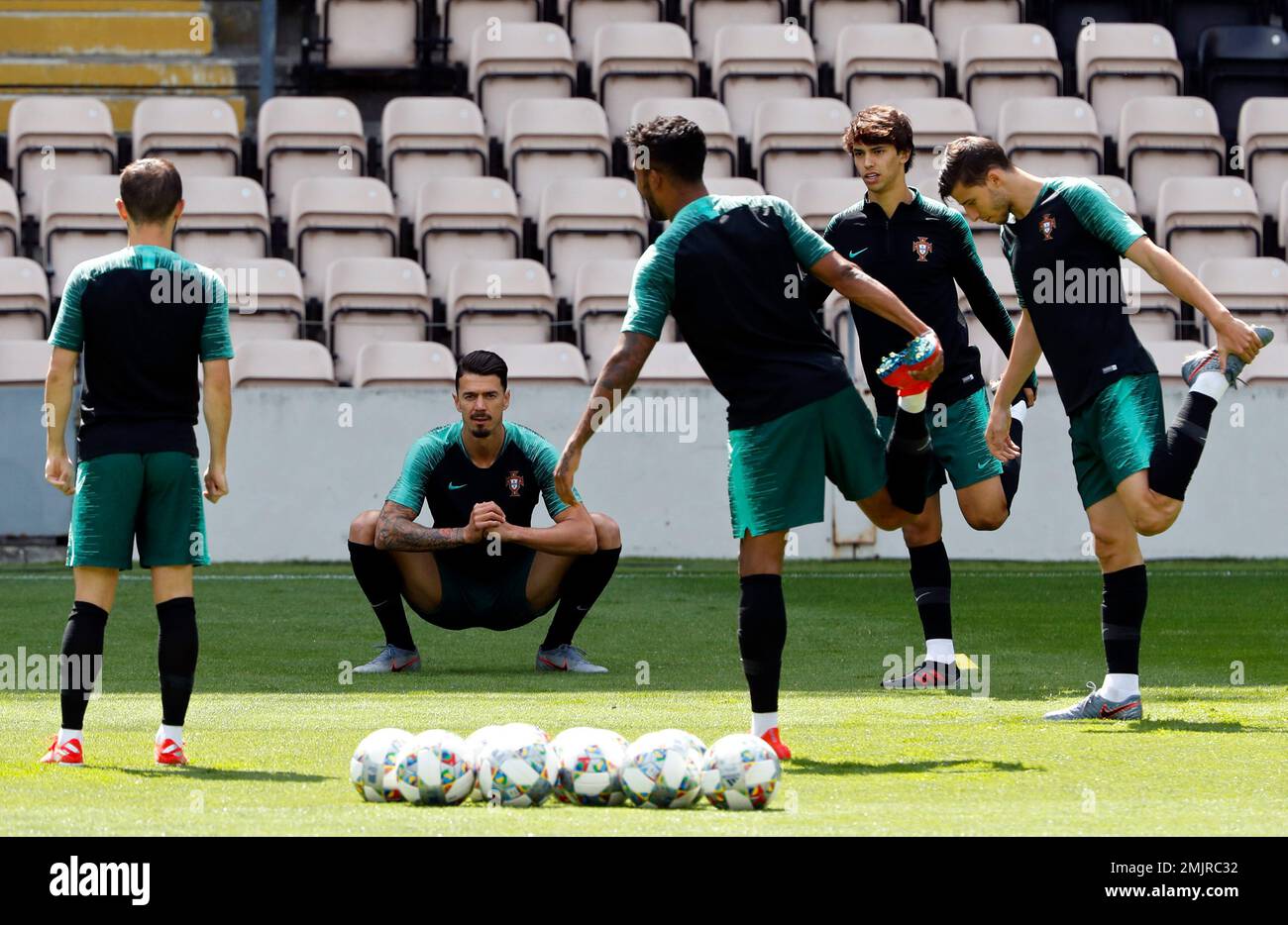Portugal's Jose Fonte, 2nd left, stretches during a training session at ...