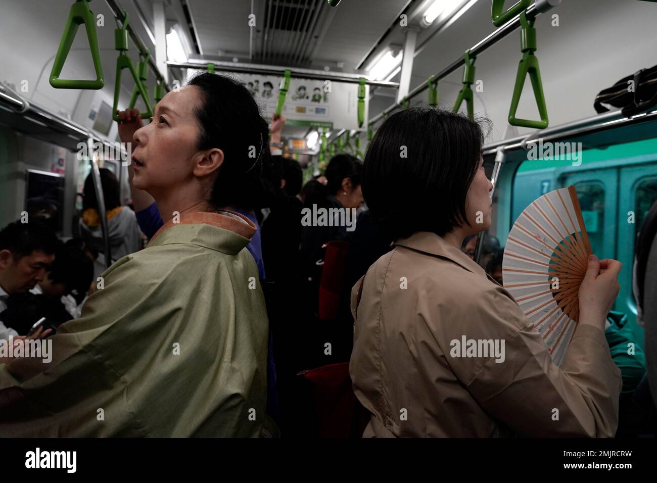 In this Tuesday, May 21, 2019, photo, a woman wearing a kimono looks at ...