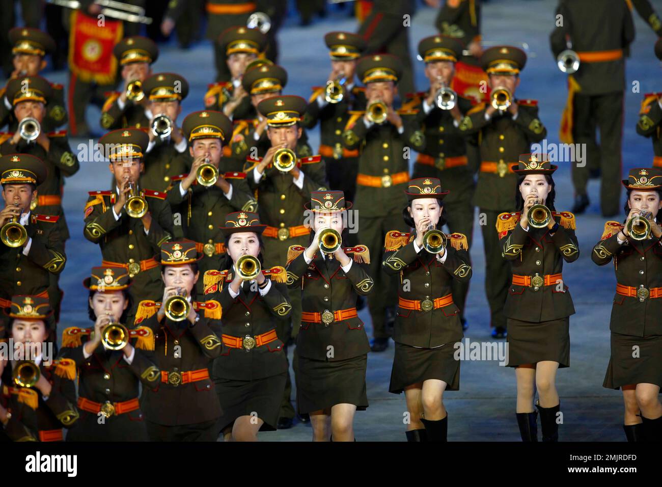 Female brass band members perform "The Land of the People" at the May ...