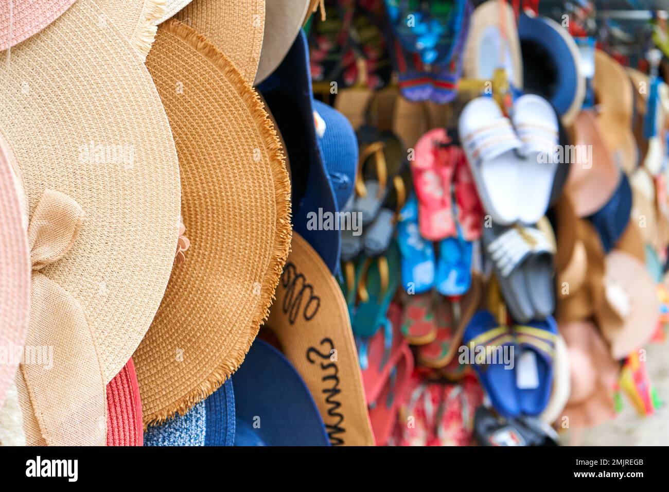 Shop with hats of various styles in the street market. Showcase with ...