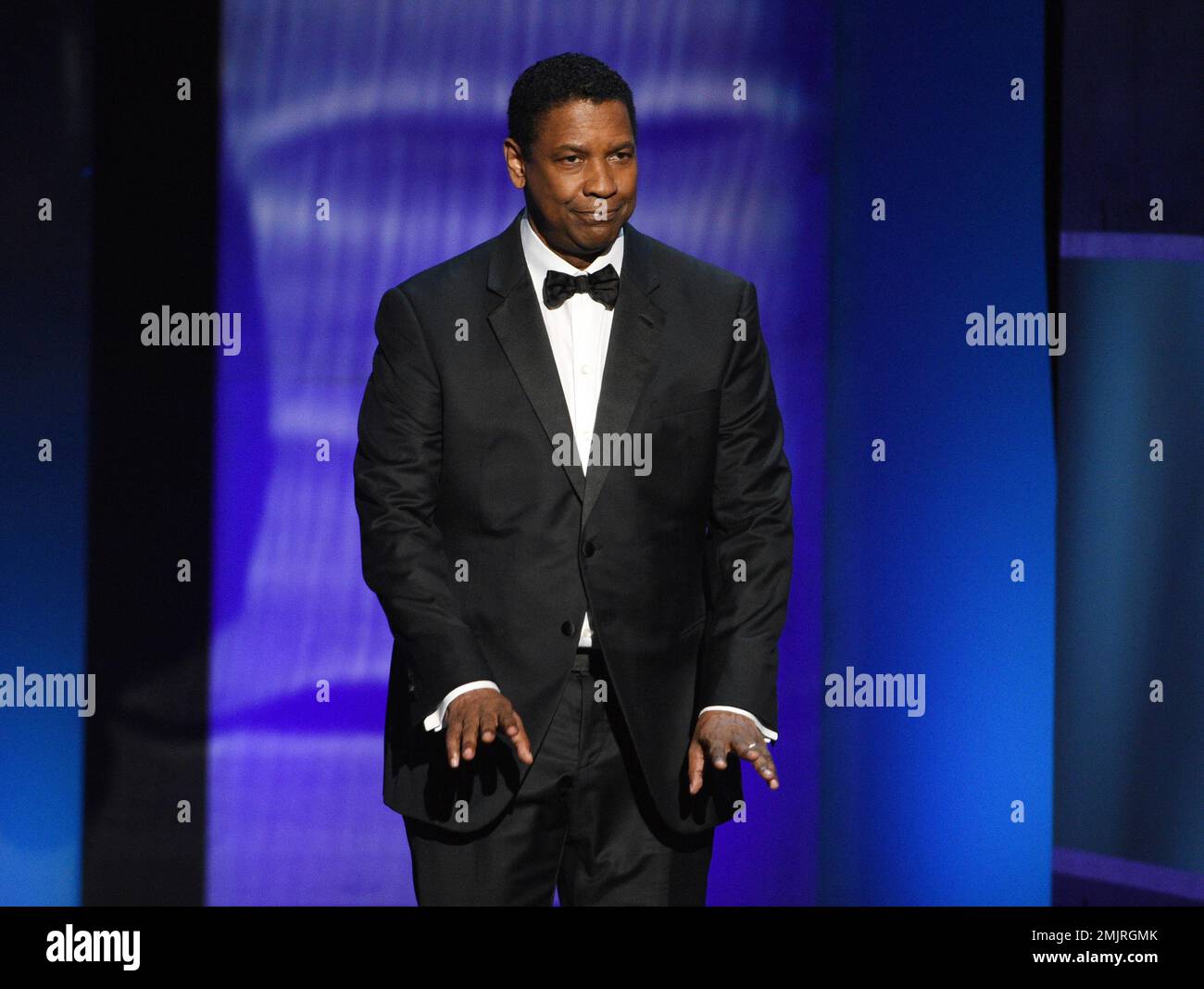 Actor Denzel Washington acknowledges applause from the audience as he ...