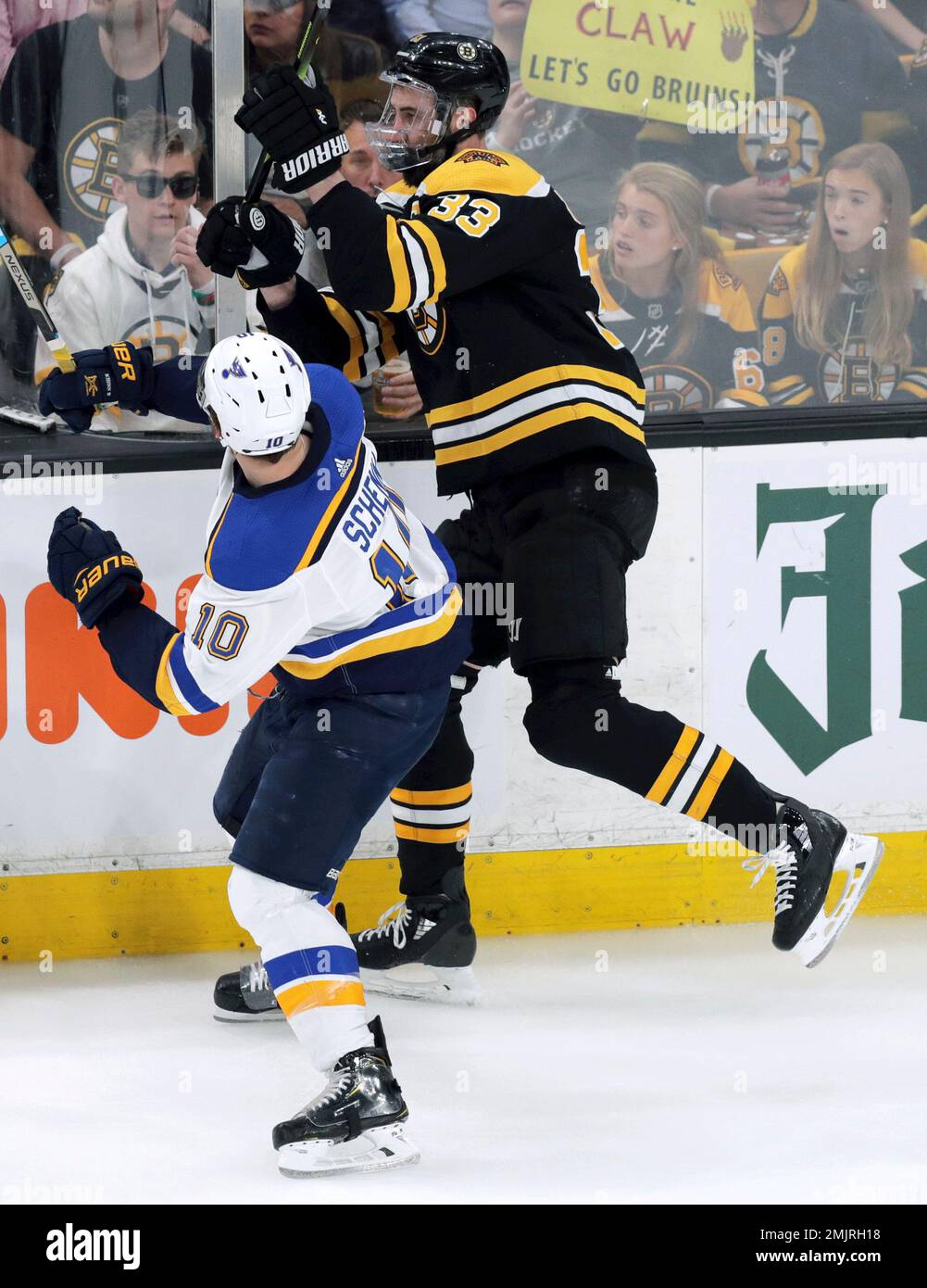 St. Louis Blues' Brayden Schenn, left, checks Boston Bruins' Zdeno ...
