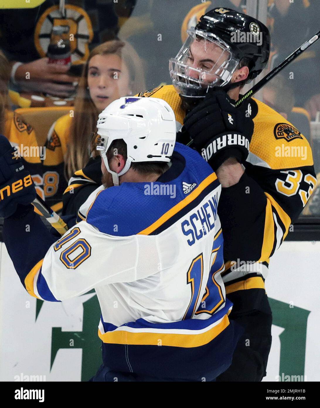 St. Louis Blues' Brayden Schenn, left, checks Boston Bruins' Zdeno ...