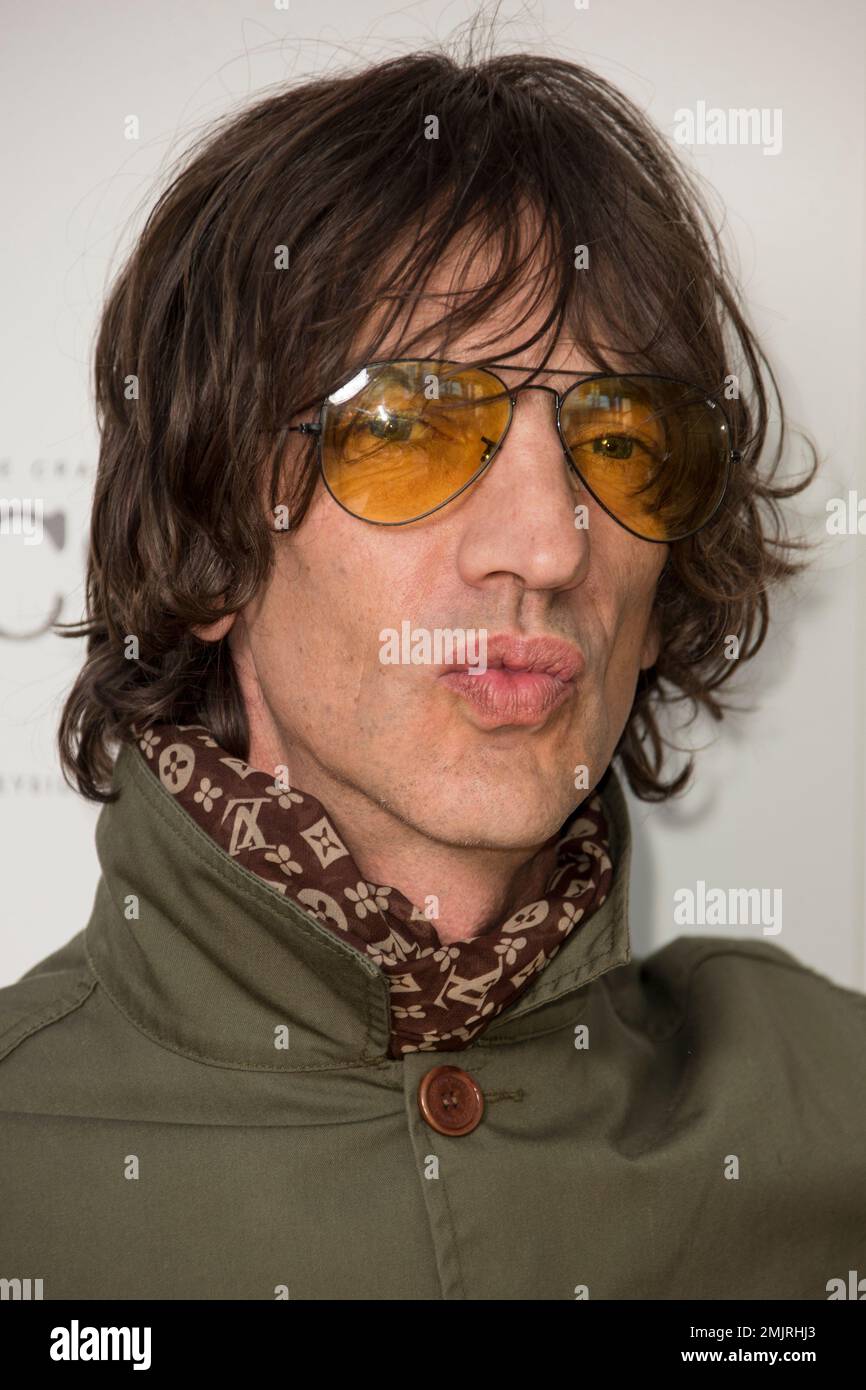 Singer Richard Ashcroft poses for photographers upon arrival at the ...