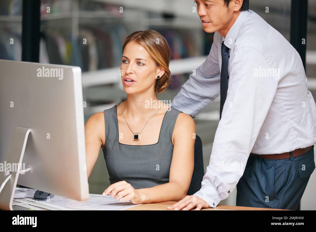 Staying on top of important tasks. two colleagues working together on a ...