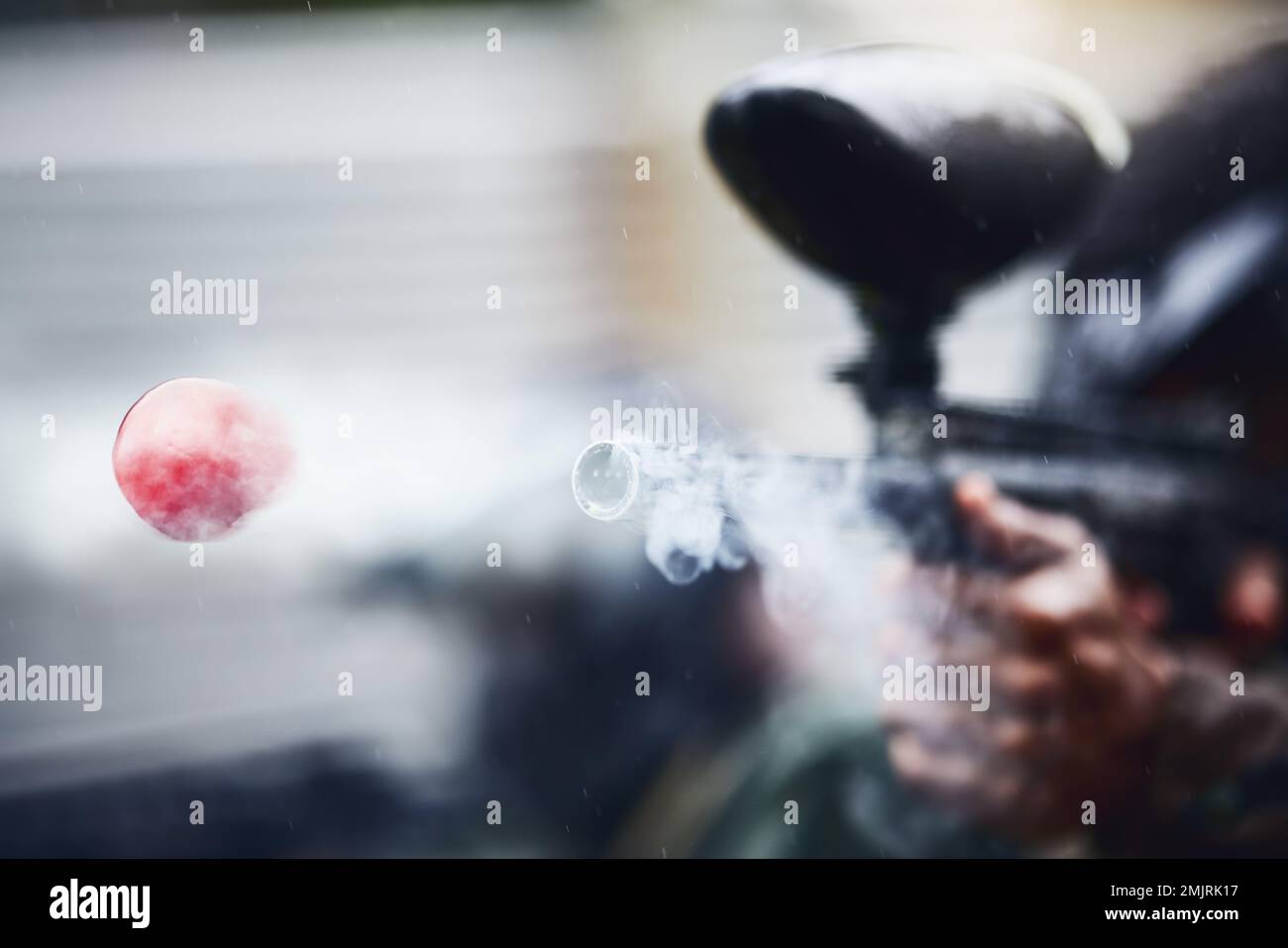 Closeup, person and paintball gun shooting with ball for fun, extreme ...