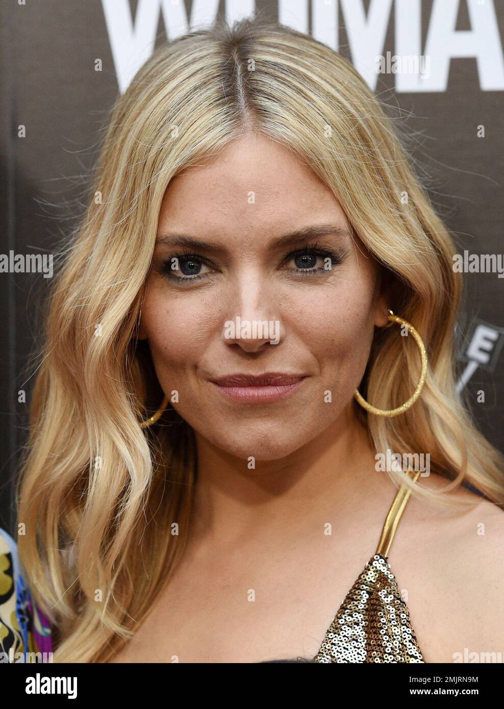 Sienna Miller, a cast member in "American Woman," poses at the premiere ...