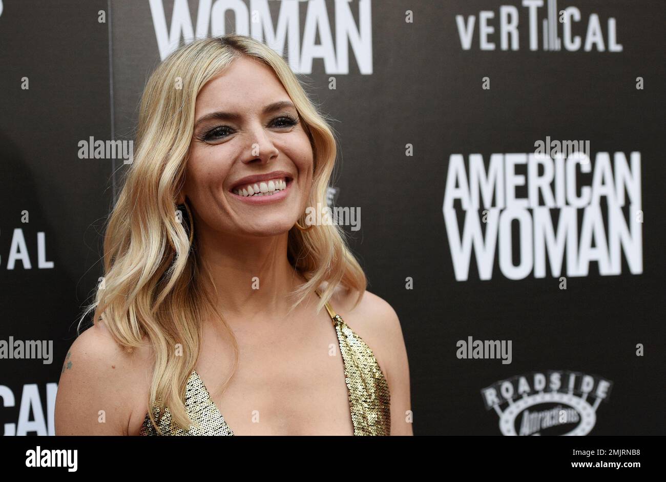 Sienna Miller, a cast member in "American Woman," poses at the premiere ...