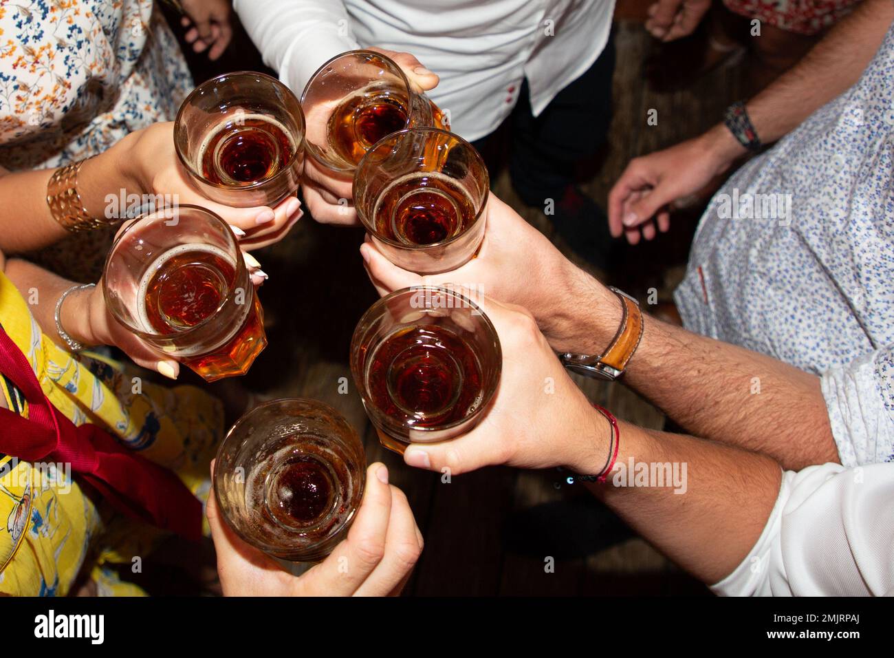 Top view clinking glasses with drink in hands holiday party cheers of ...