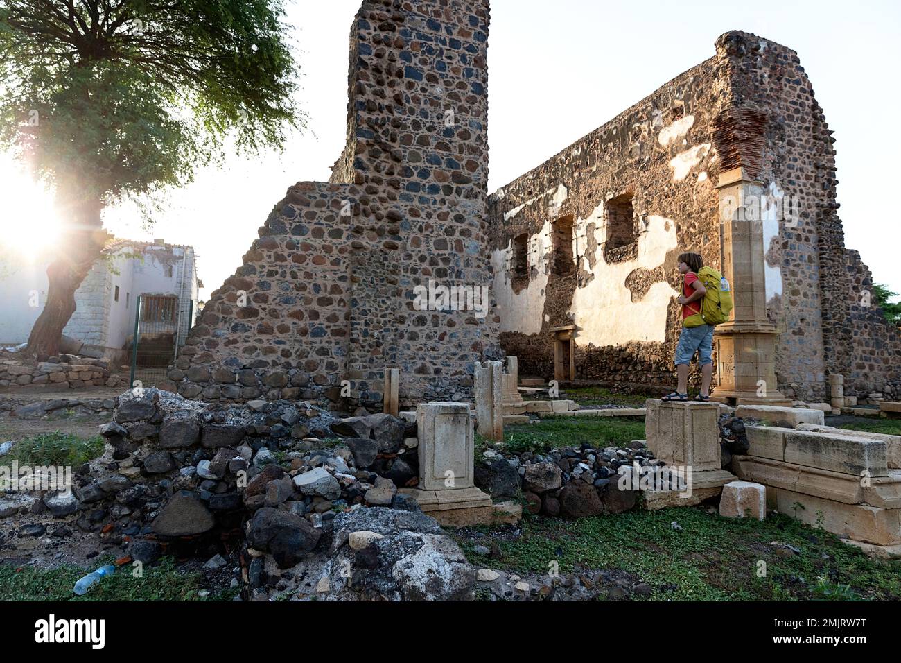 Kid tourist exploring Sé Cathedral ruins on a hill above the oldest ...