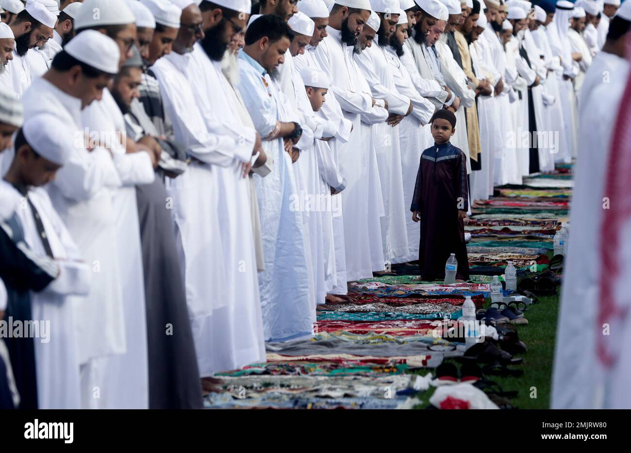 Panamanian Muslims stand during Eid al-Fitr prayer, which marks the end ...