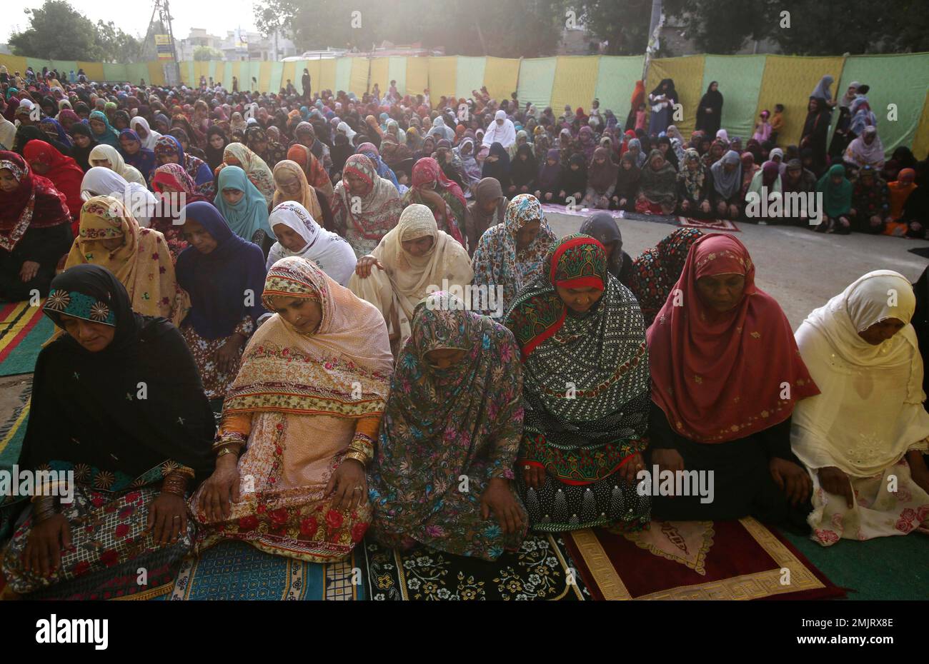 Pakistani Muslims offer the Eid al-Fitr prayer, which marks the end of ...