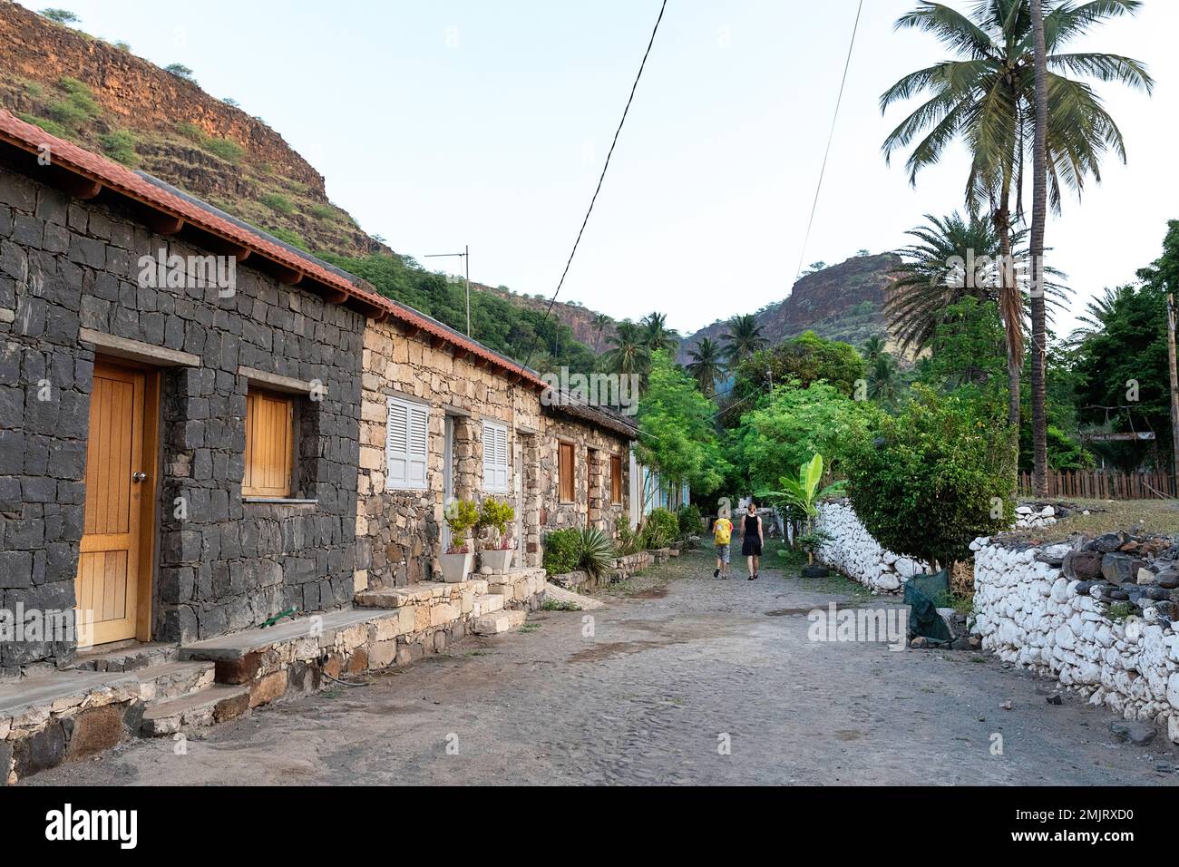 Tourists on holidays exploring old traditional houses in the oldest ...
