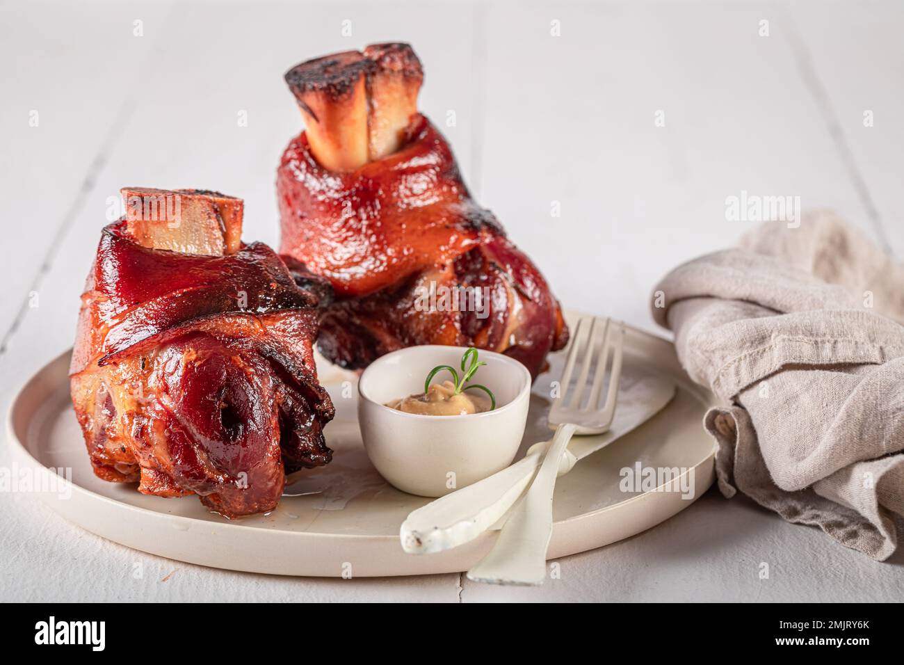 Delicious ham hock baked in casserole with spices. Roasted Schweinshaxe ...