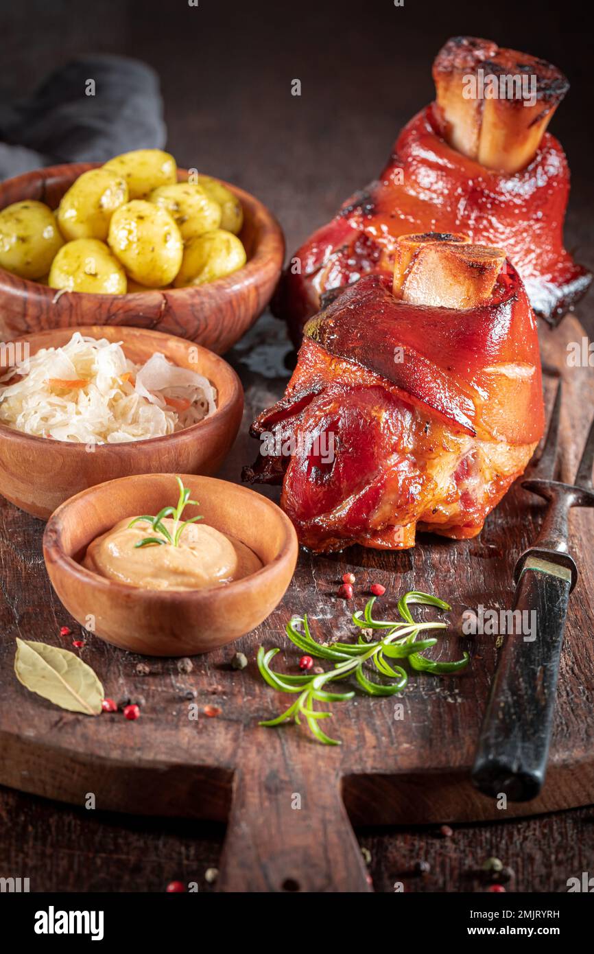 Homemade roasted pork knuckle served with potatoes and pickled cabbage ... Homemade roasted pork knuckle served with potatoes and pickled cabbage ...