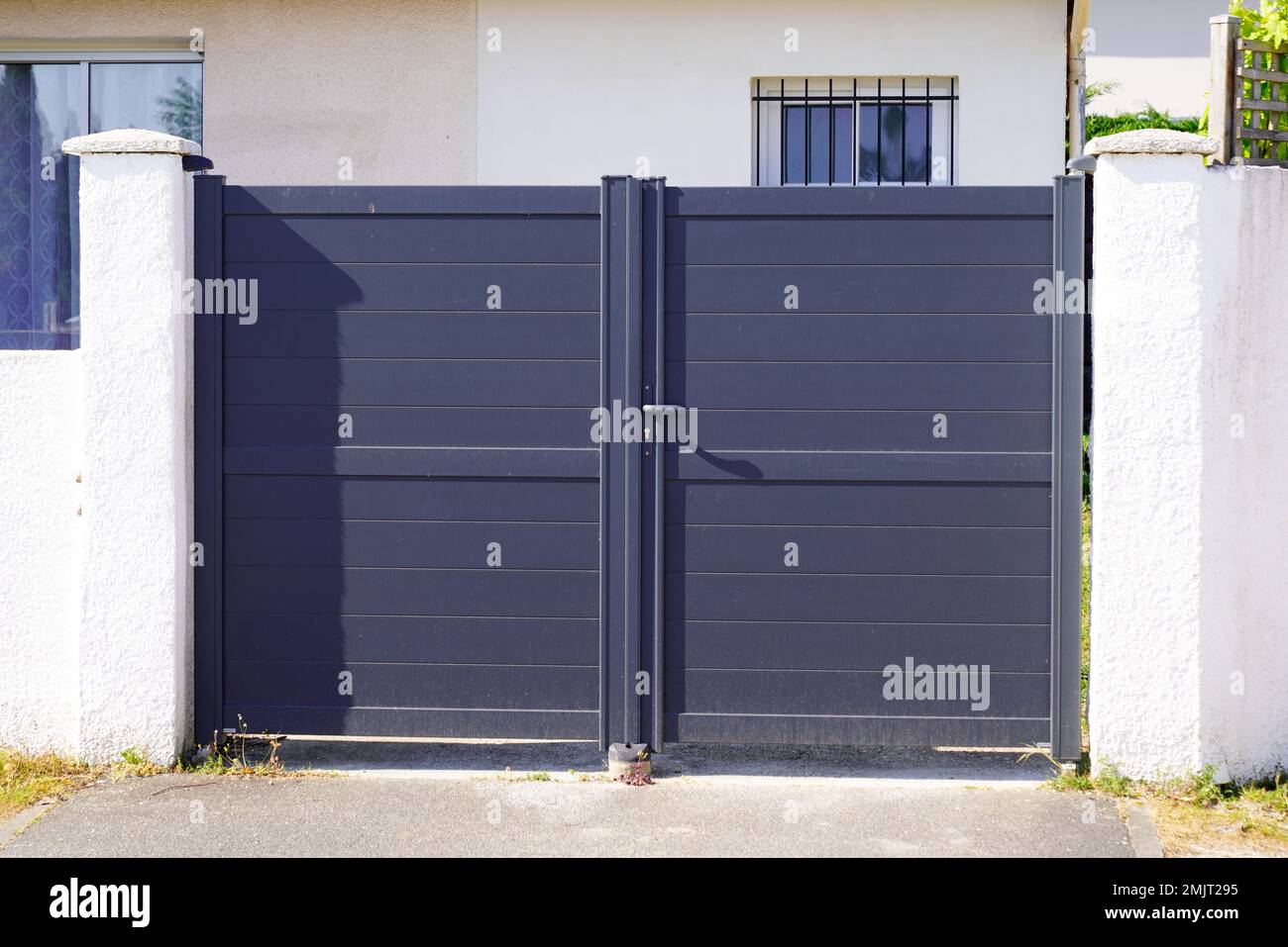 portal steel high grey metal gate fence on modern house door Stock ...