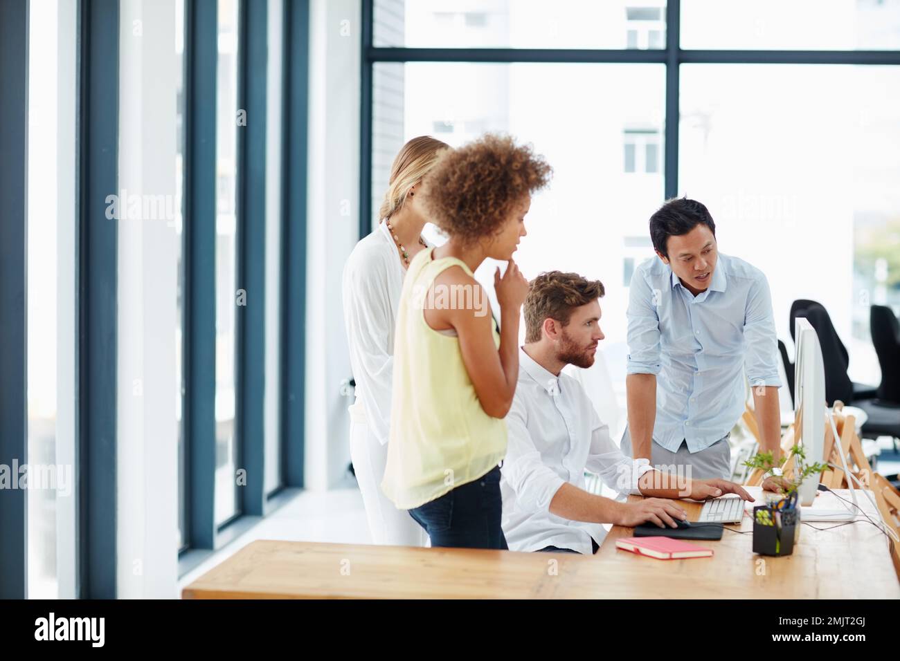 One challenge, multiple approaches. a group of colleagues looking at ...