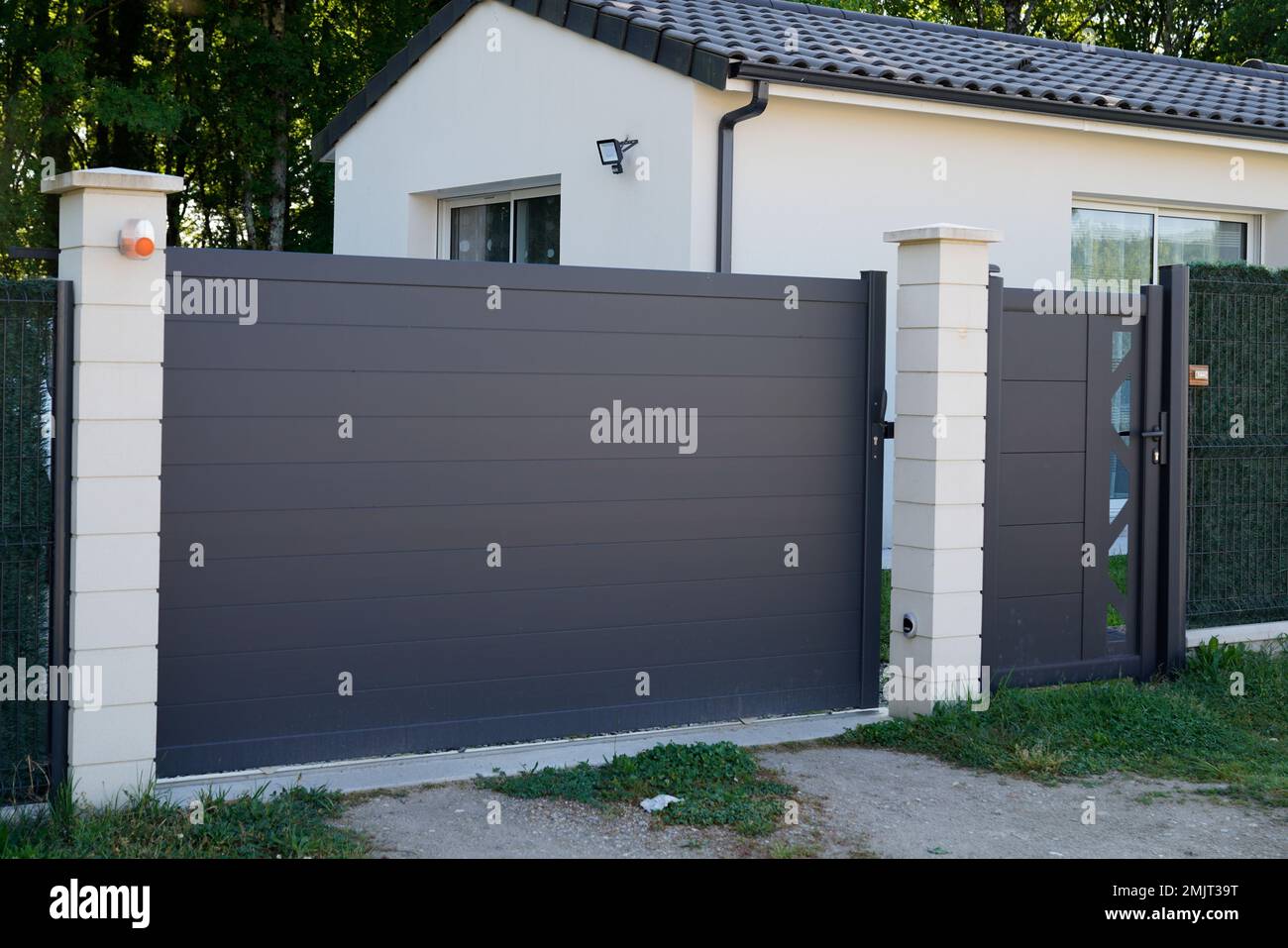 sliding brown gate modern aluminum portal to home access door Stock ...