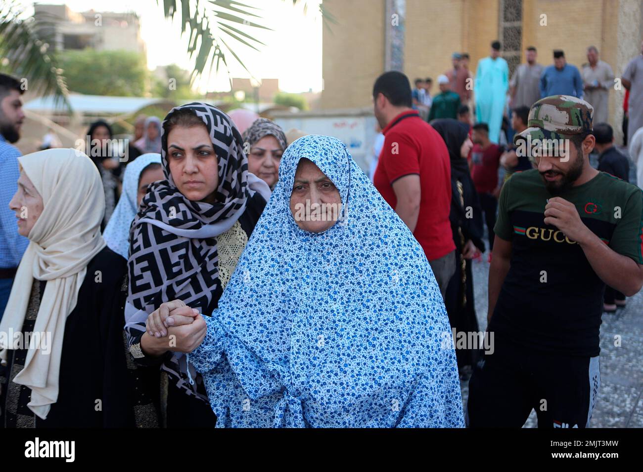 Muslims leave the 17th of Ramadan mosque after prayers on the first day ...