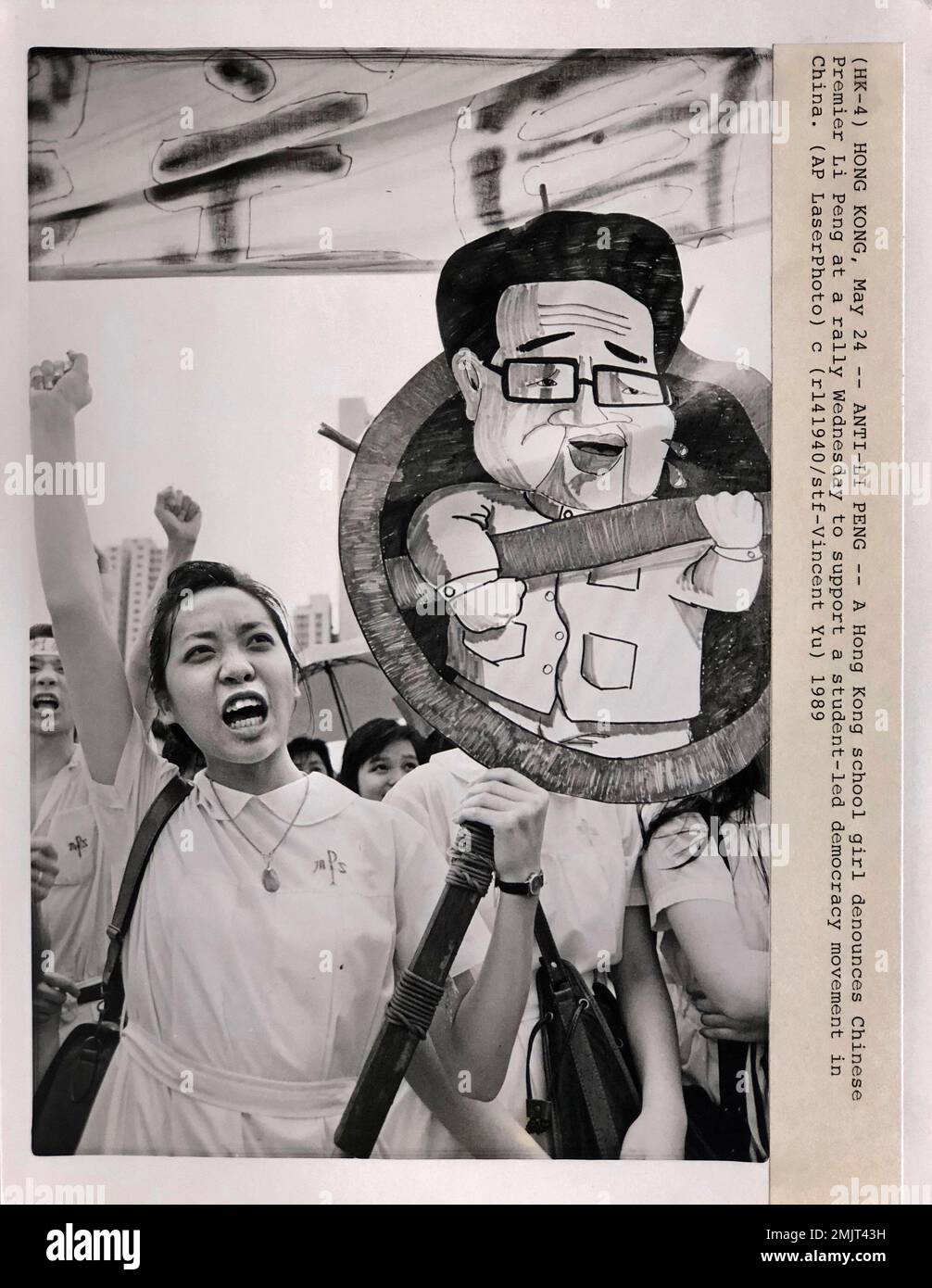 n this photo taken on May 24, 1989, a Hong Kong school girl denounces Chinese Premier Li Peng ...