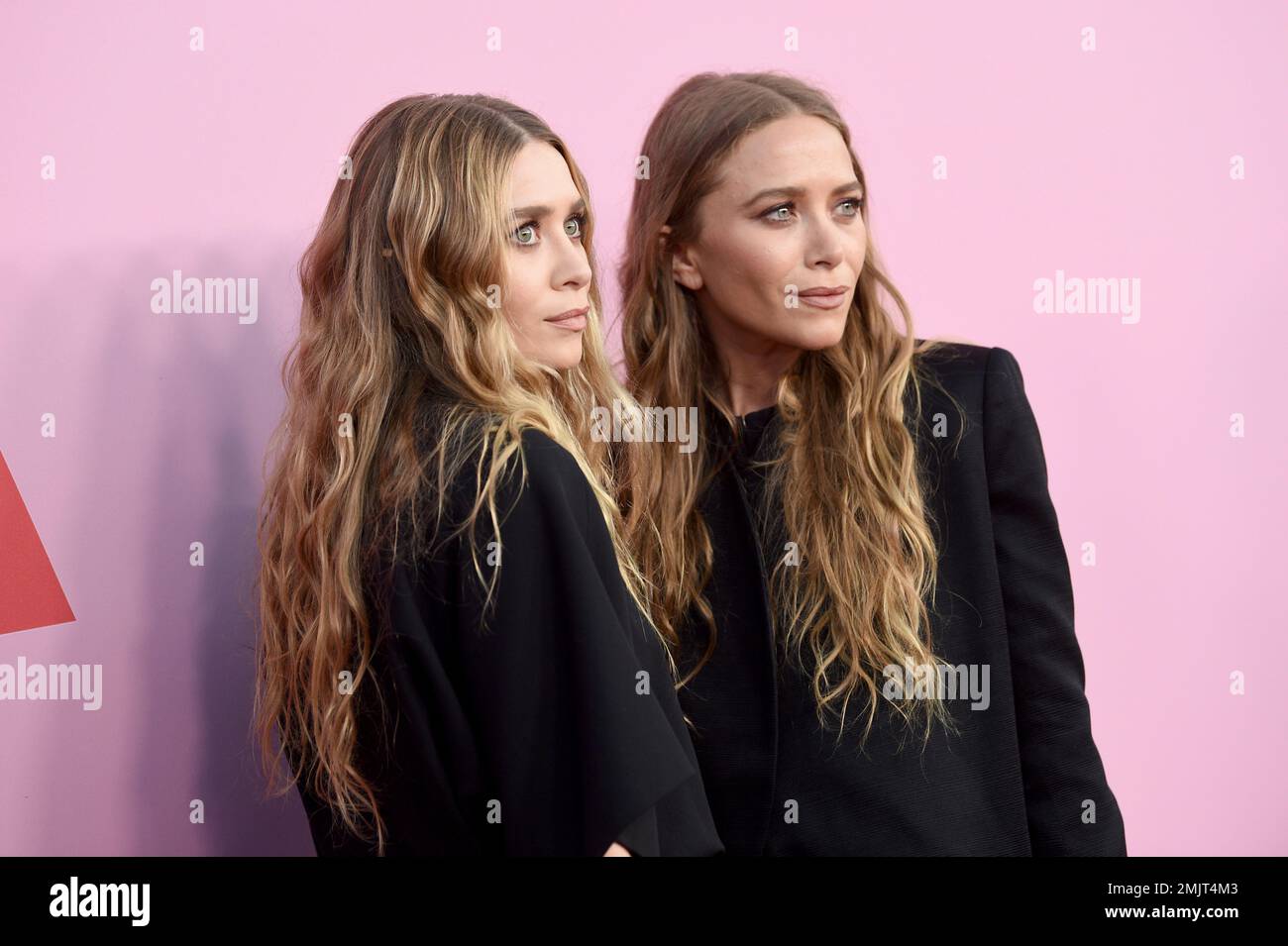 Ashley Olsen, left, and Mary-Kate Olsen attend the CFDA Fashion Awards ...