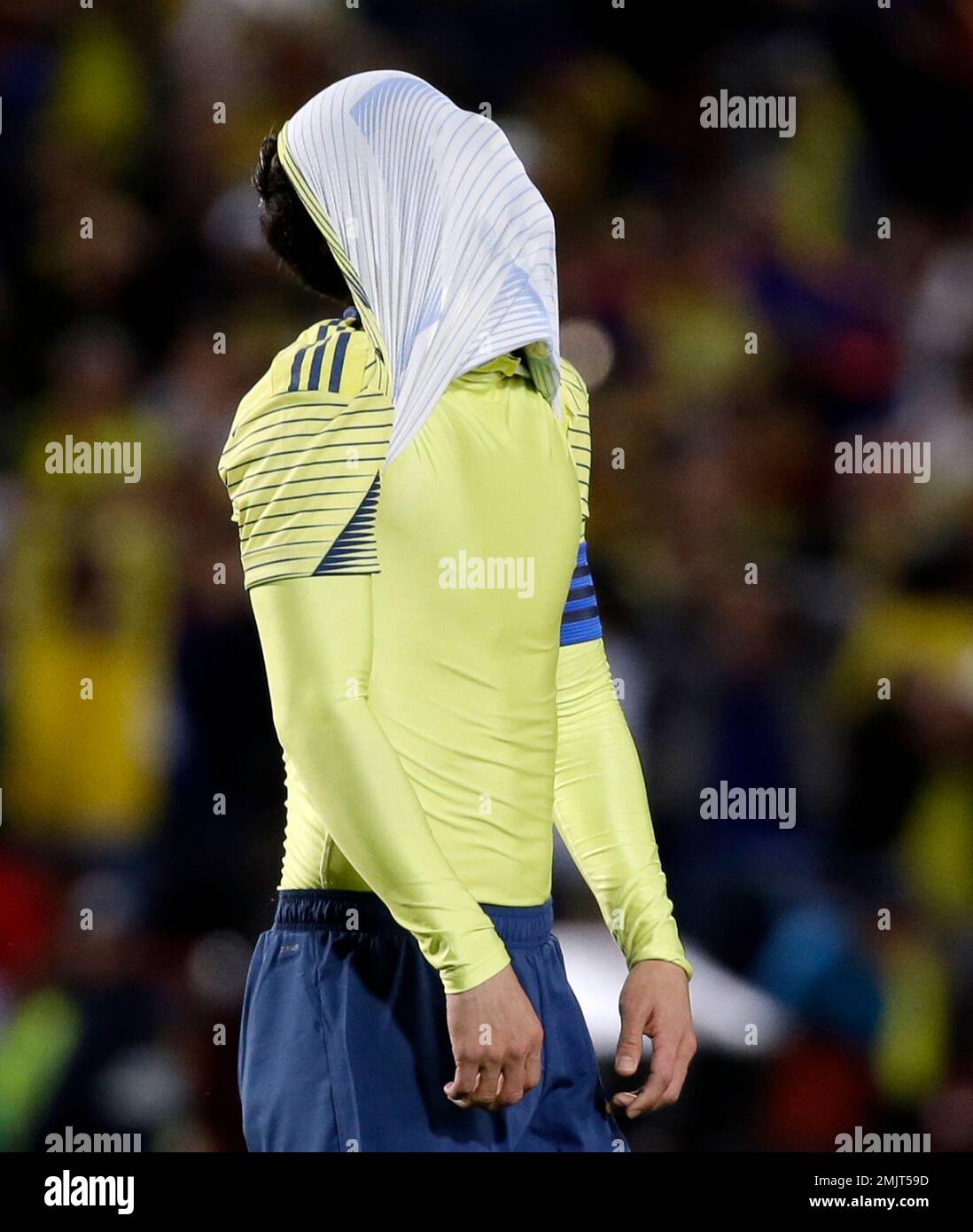 Colombia's James Rodriguez covers his face after missing a chance to ...