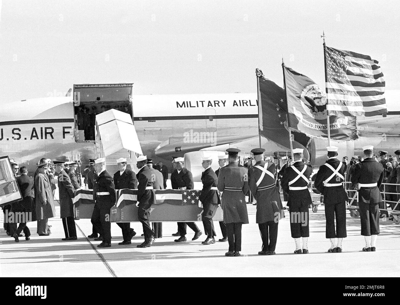Airmen and sailors bear the flag-draped caskets of Astronauts Virgil ...