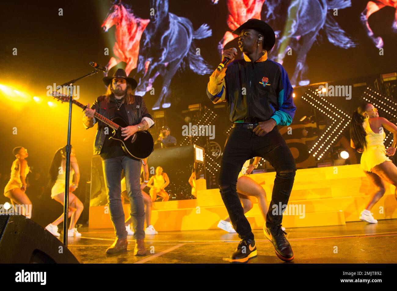Musical artists Billy Ray Cyrus, left, and Lil Nas X perform at HOT 97 ...