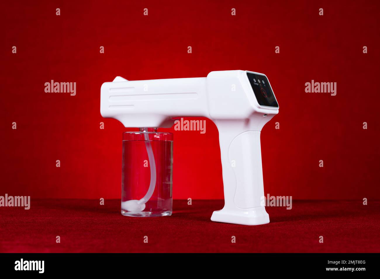 rechargeable electric gun with disinfectant liquid Stock Photo - Alamy