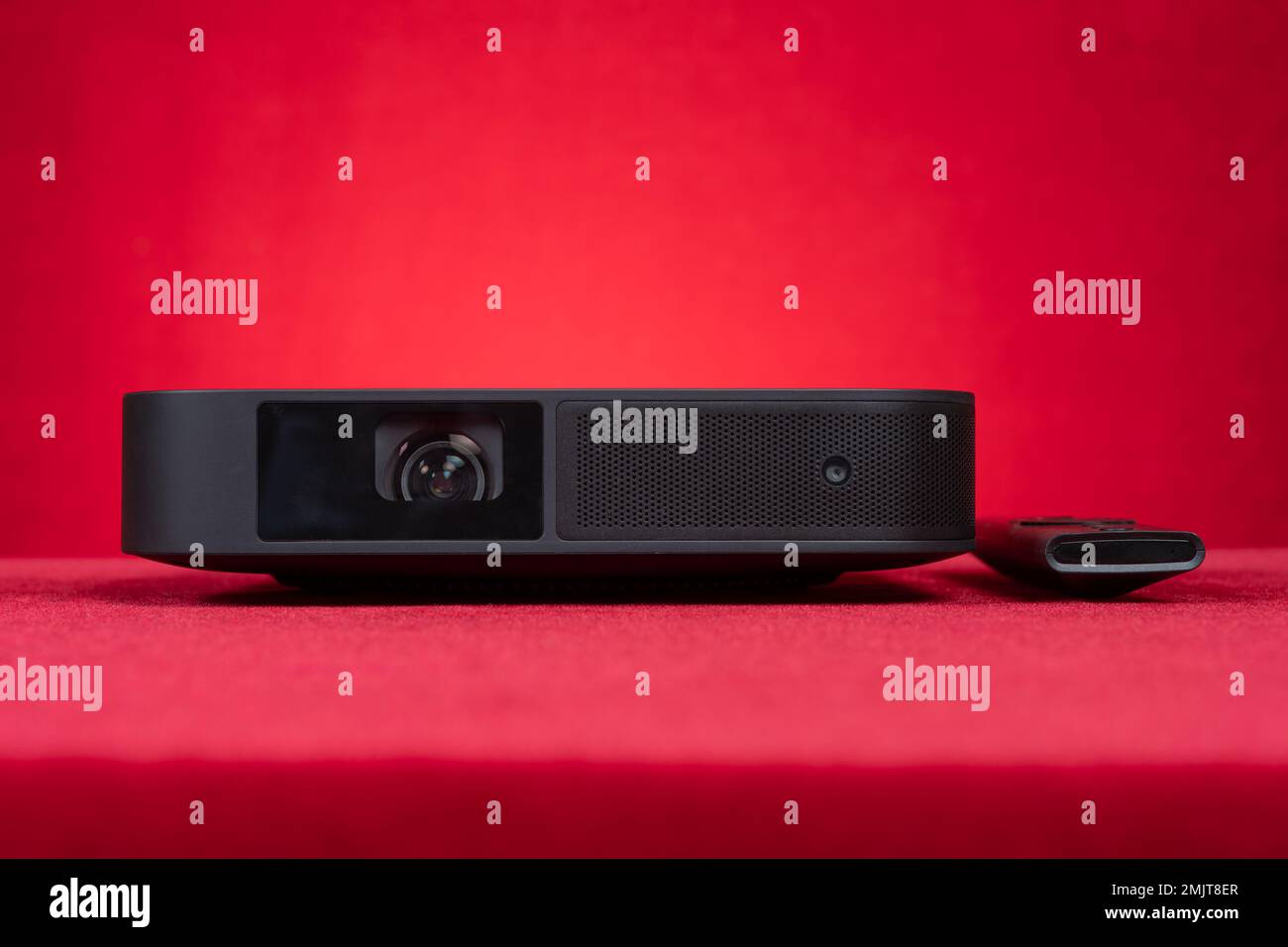 projector on a red background Stock Photo - Alamy