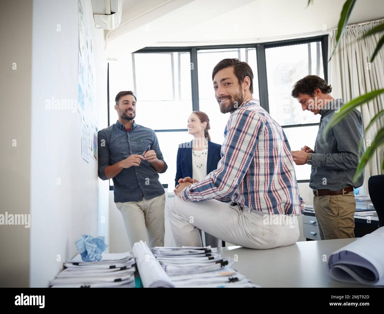 Great things are happening behind me. Portrait of a group of colleagues ...