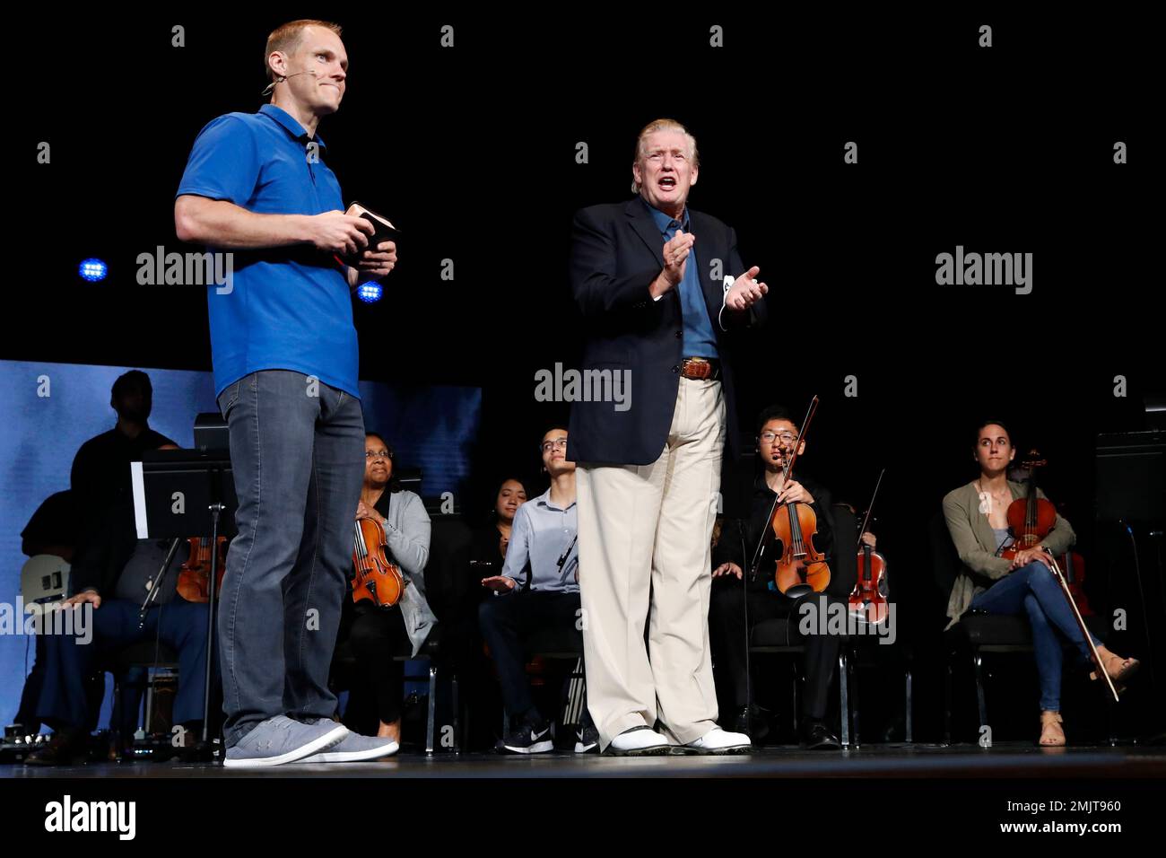 President Donald Trump reacts after Pastor David Platt, left, prayed ...