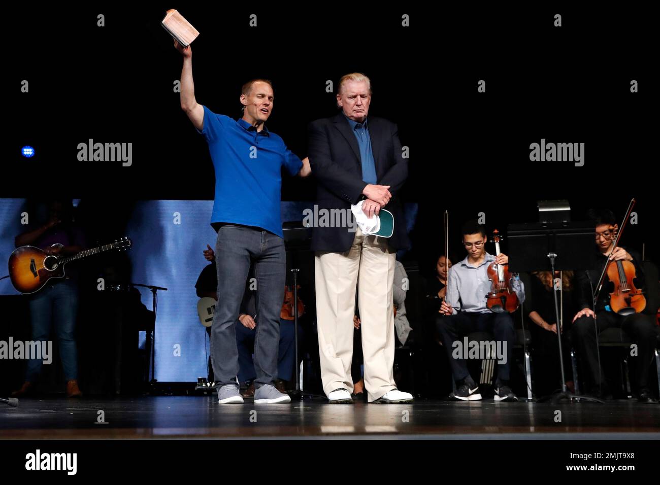 Pastor David Platt, left, prays for President Donald Trump at McLean ...