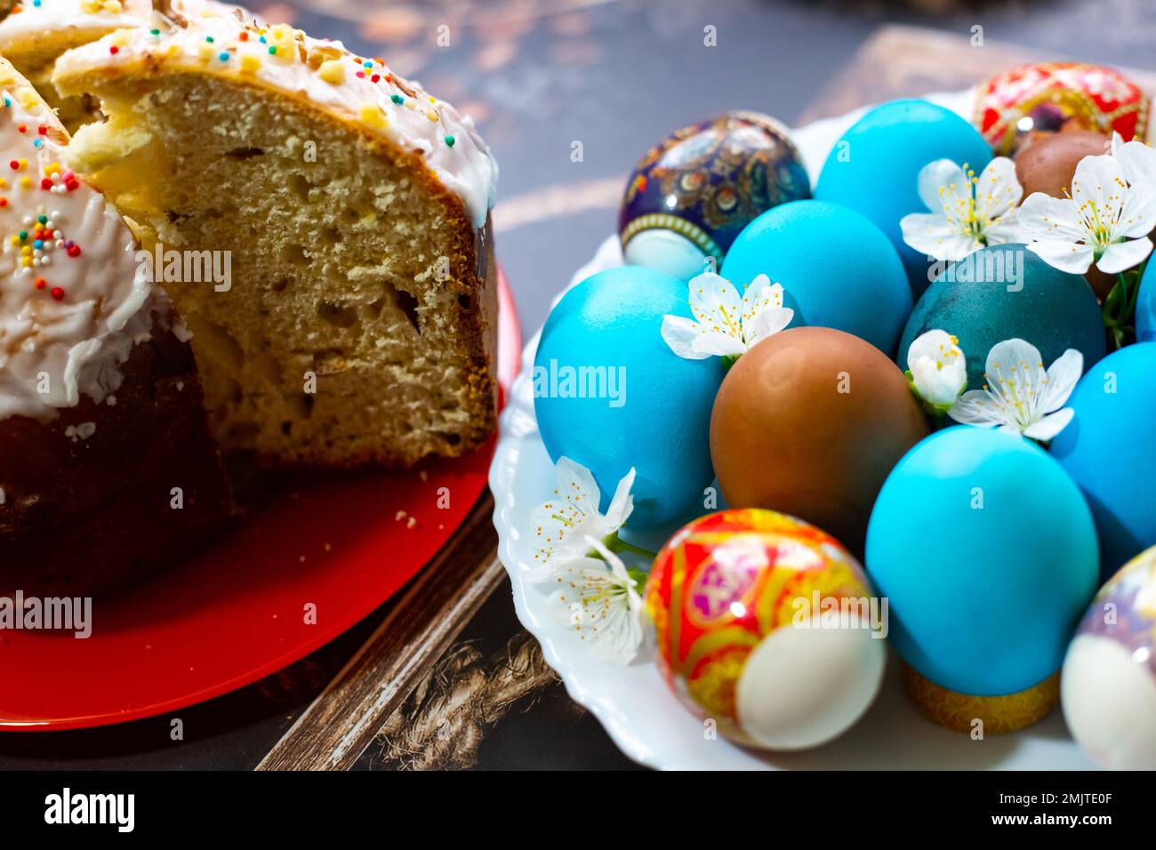 The Feast of Holy Easter. Painted eggs and Easter cakes on platters ...