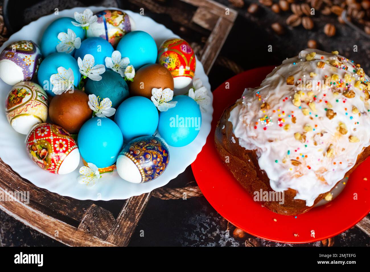 The Feast of Holy Easter. Painted eggs and Easter cakes on platters ...