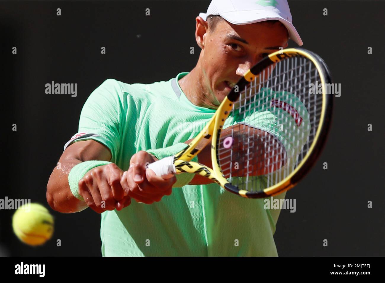 France's Antoine Hoang plays a shot against France's Gael Monfils ...