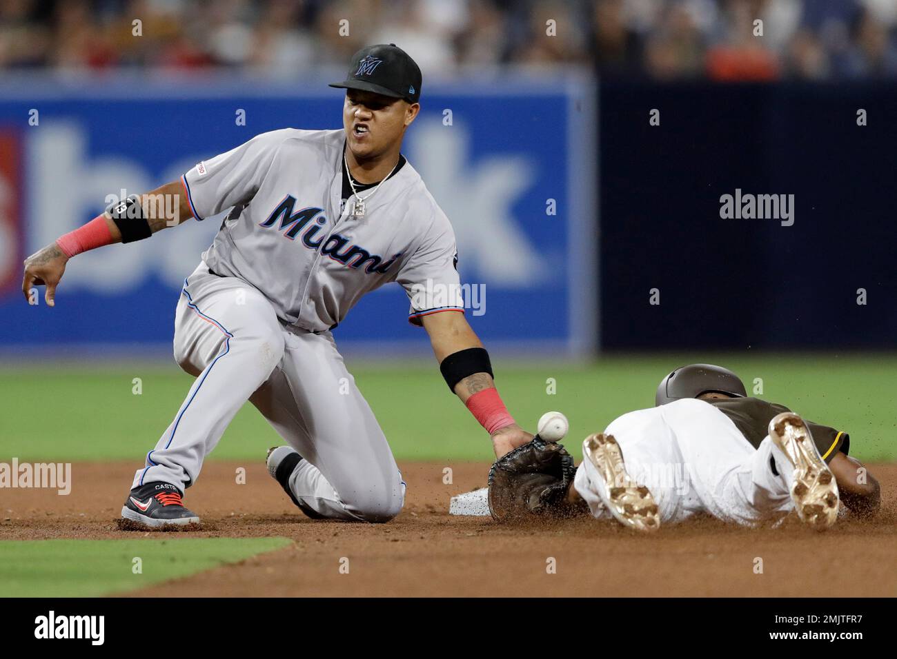 Miami Marlins second baseman Starlin Castro, left, can't catch the ...