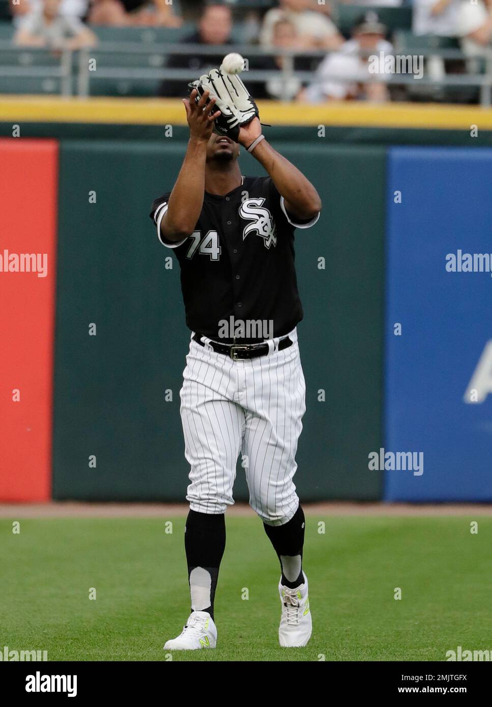 Chicago White Sox left fielder Eloy Jimenez catches a fly ball hit by ...