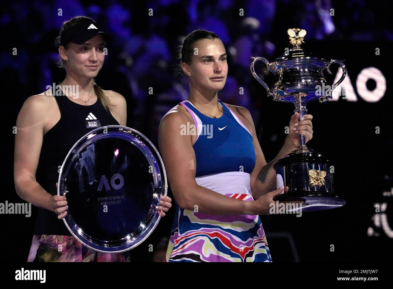 Aryna Sabalenka, right, of Belarus holds the Daphne Akhurst Memorial Trophy after defeating ...