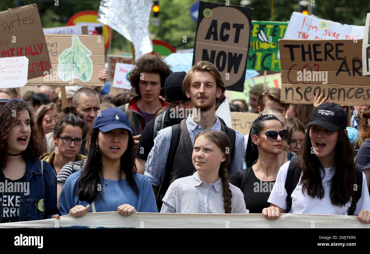 Swedish climate activist Greta Thunberg, center, takes part in the ...