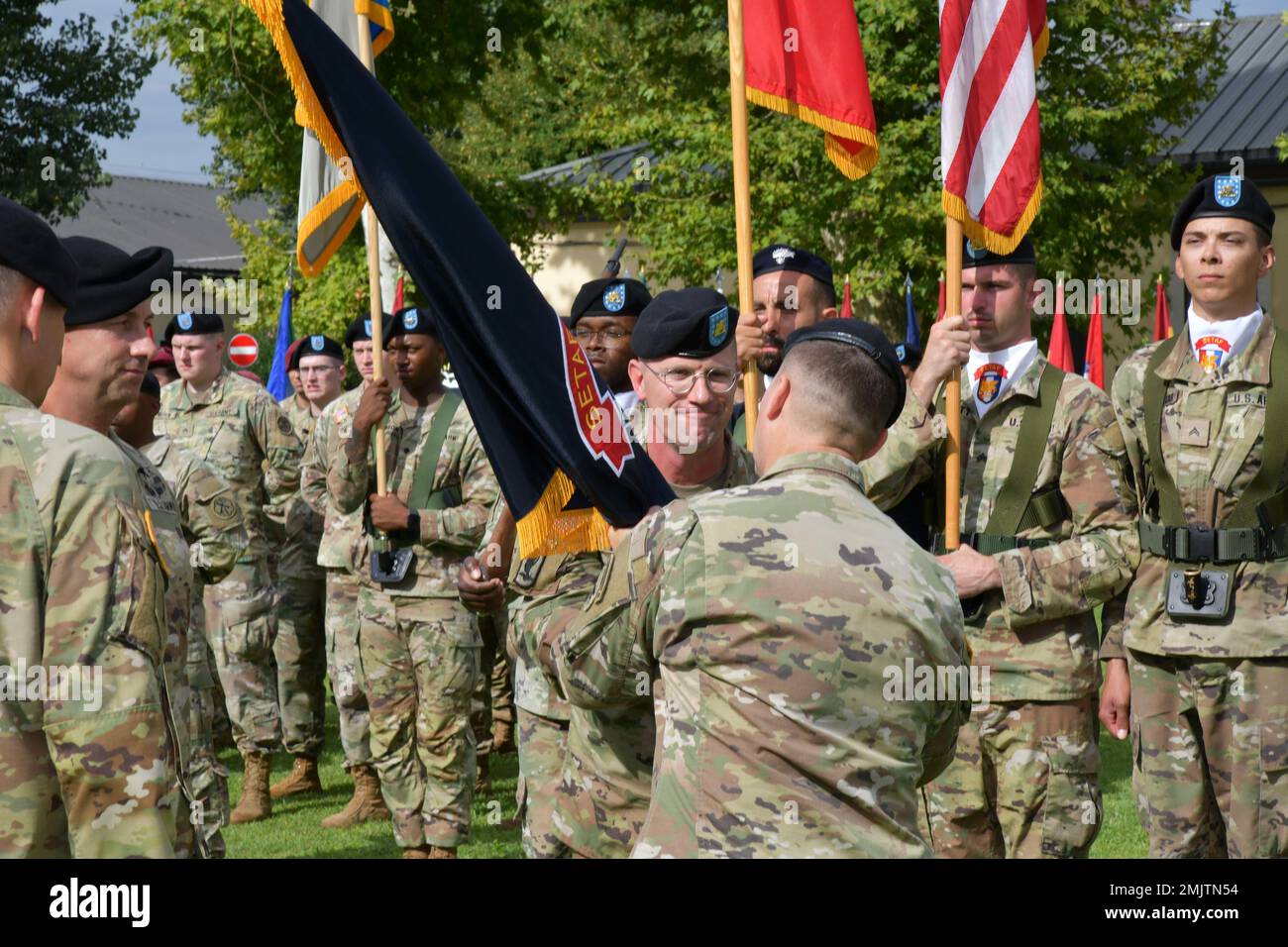 Command Sergeant Major Charles W. Gregory, Jr., the outgoing Command Sgt. Major, receives the U ...