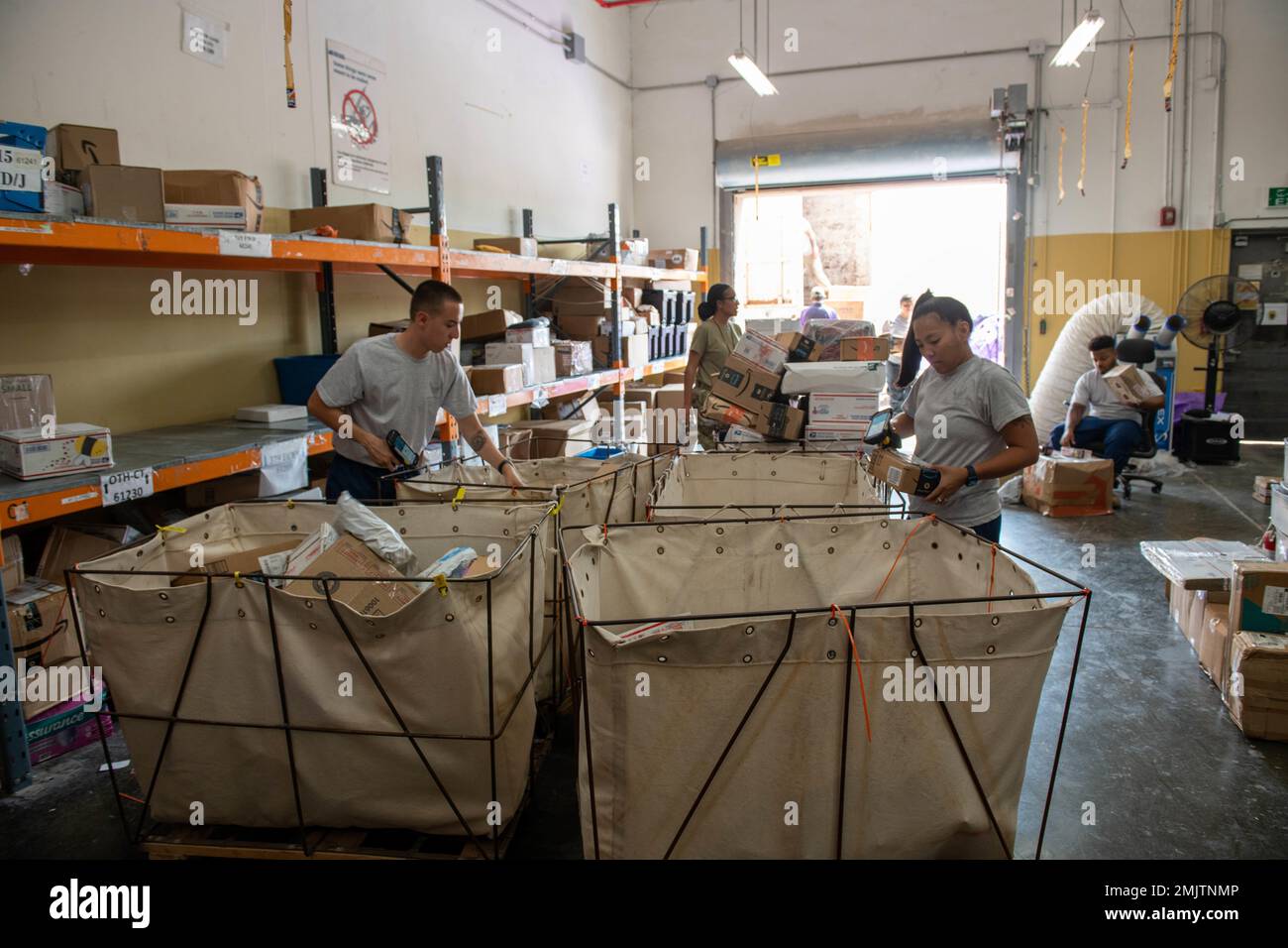 U.S. Air Force military postal clerks from the 379th Expeditionary ...