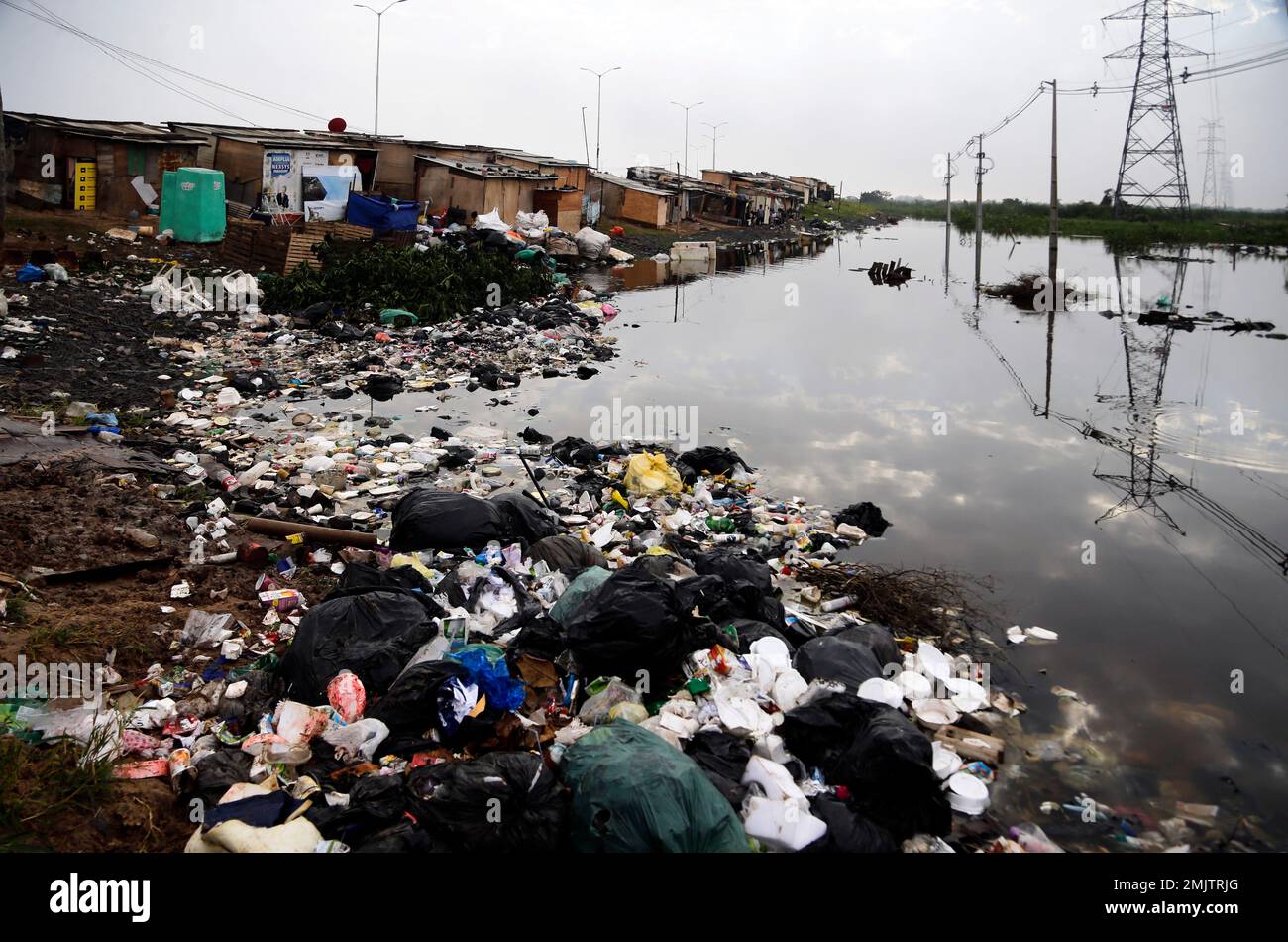 Piles of garbage sit in flood waters in the "Bañado Norte" neighborhood ...