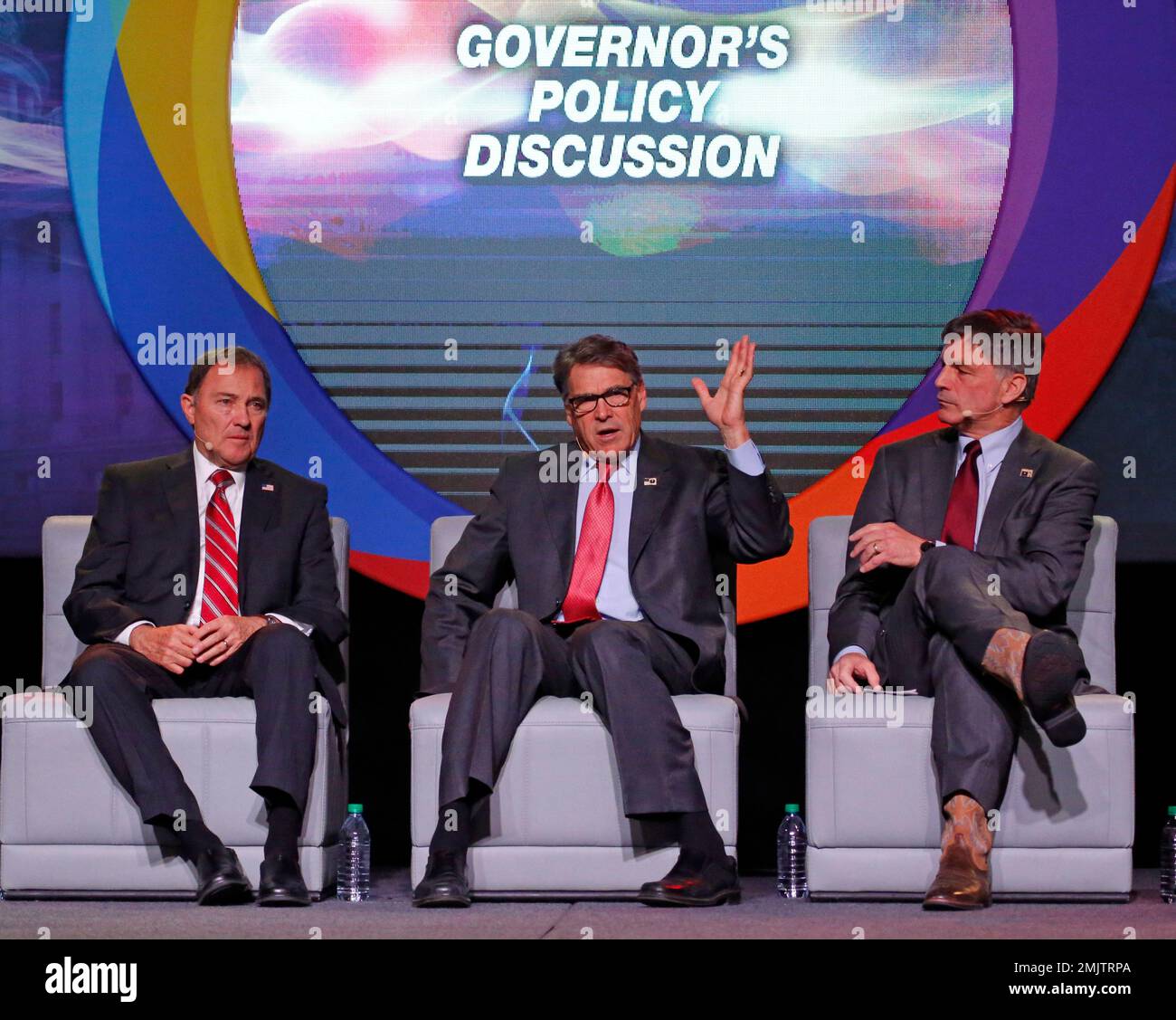 U.S. Energy Secretary Rick Perry, center, speaks as Utah Gov. Gary ...