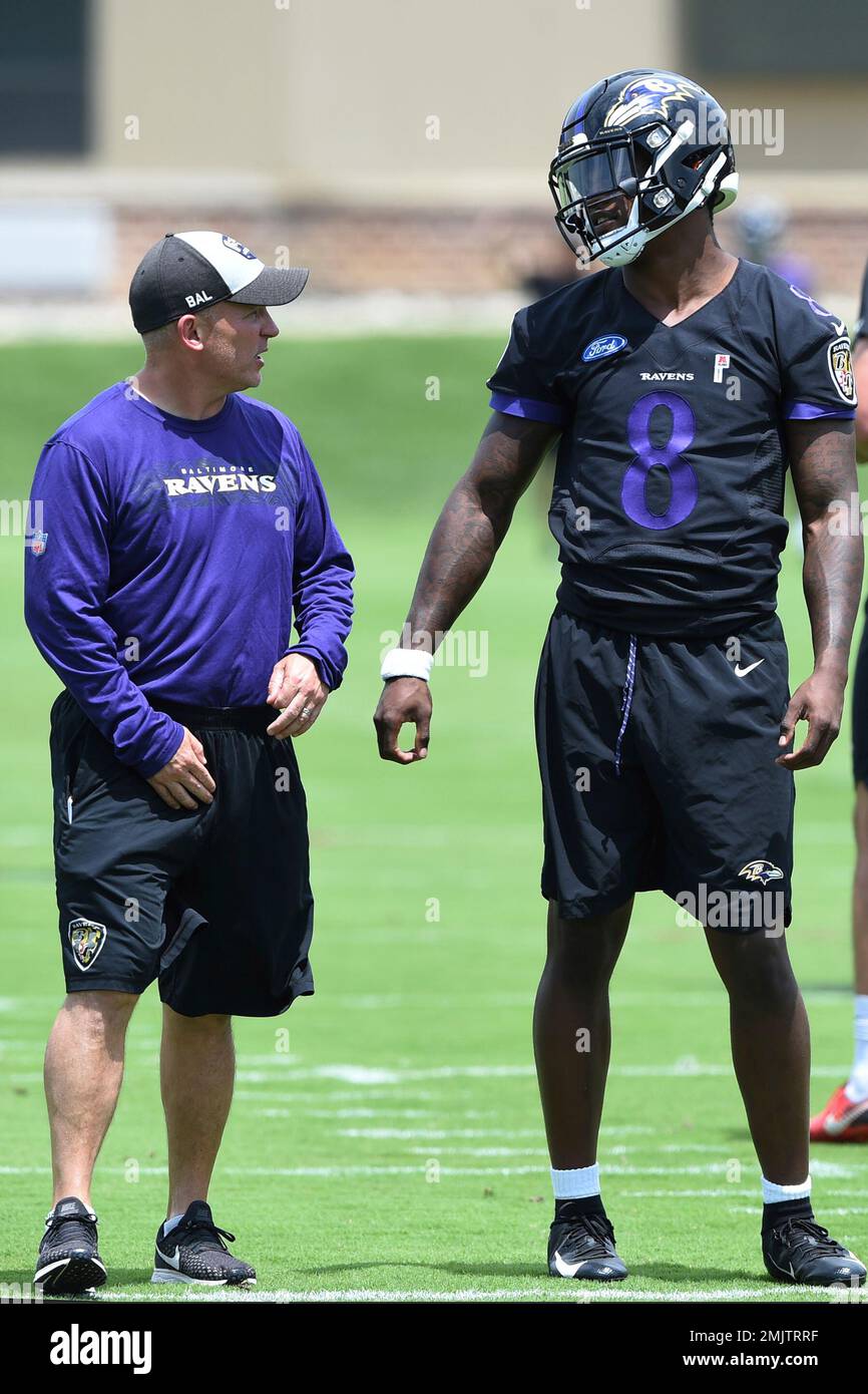 Baltimore Ravens' Lamar Jackson, right, talks with quarterback coach ...
