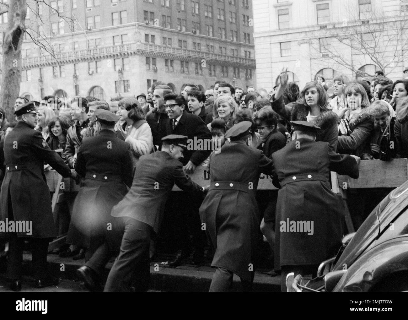 New York City police put their full weight into the task of restraining ...