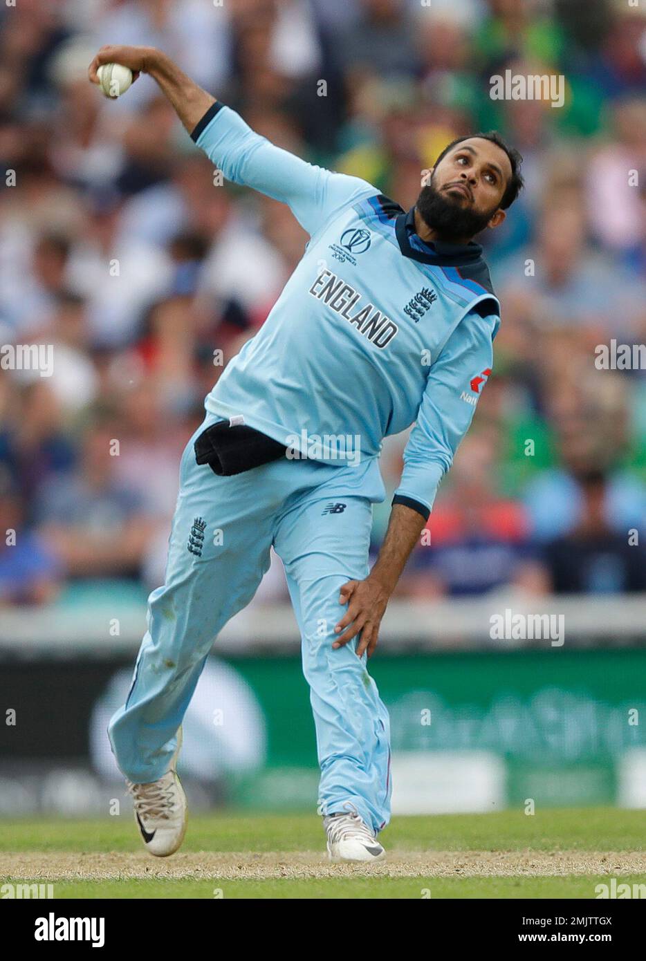 England's Adil Rashid bowls during the World Cup cricket match between ...