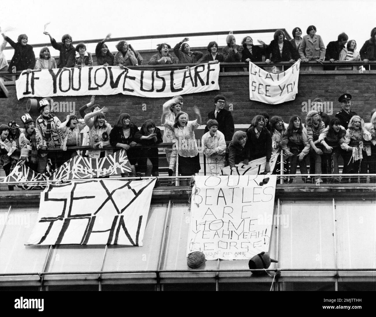 Two hundred screaming girls greet their idols, the Beatles, who flew ...