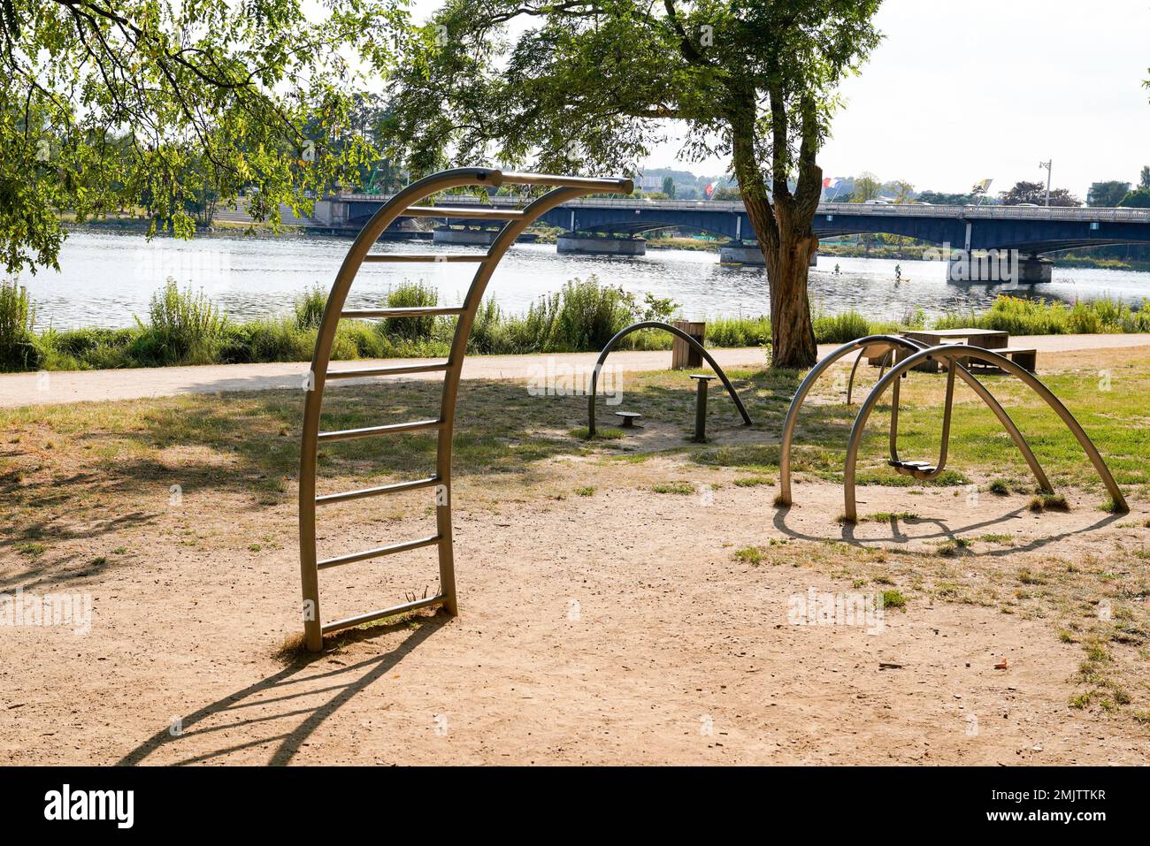 pull-ups on bar in city park empty in edge of river side for sport ...