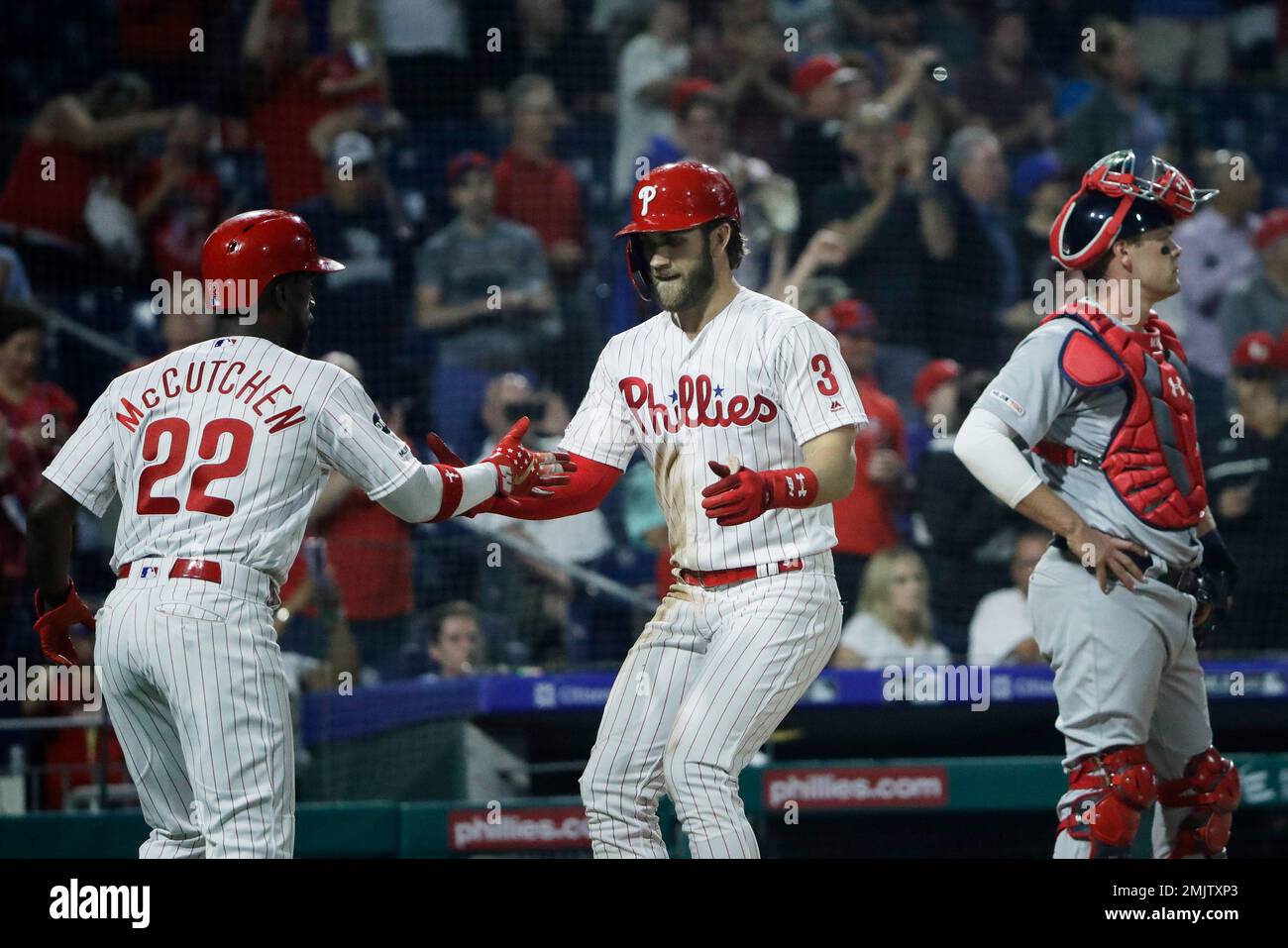 Philadelphia Phillies' Bryce Harper meets with Andrew McCutchen after ...